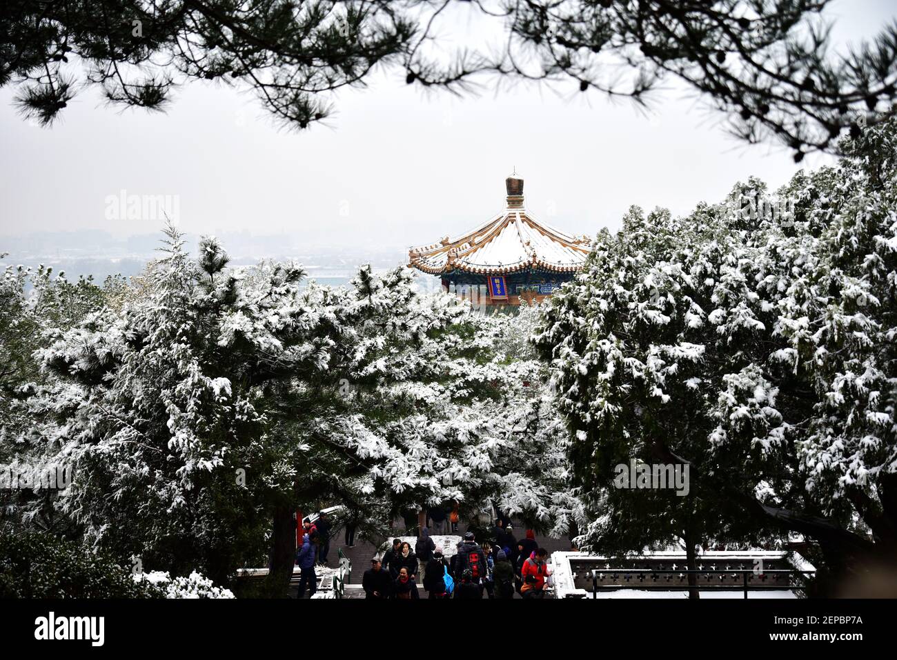 People visit Jingshan Park after the first snowfall this winter in ...