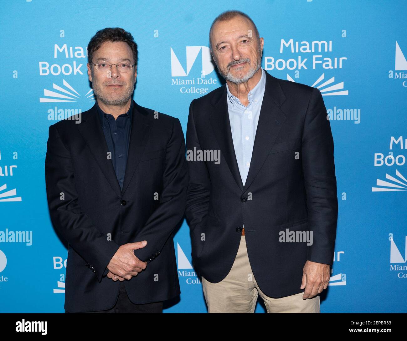 MIAMI, FL - NOV 24: Juan Carlos Botero and Author Arturo Perez-Reverte ...