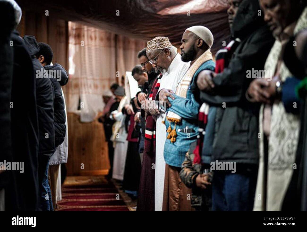Hussein Hashi Hersi, dressed in white, stood at Friday prayers at the ...