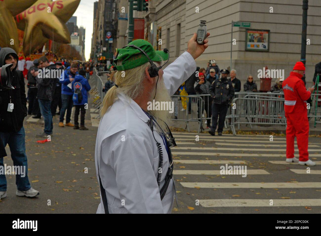 A balloon handler measure wind speed during the 93rd Annual Macy's ...