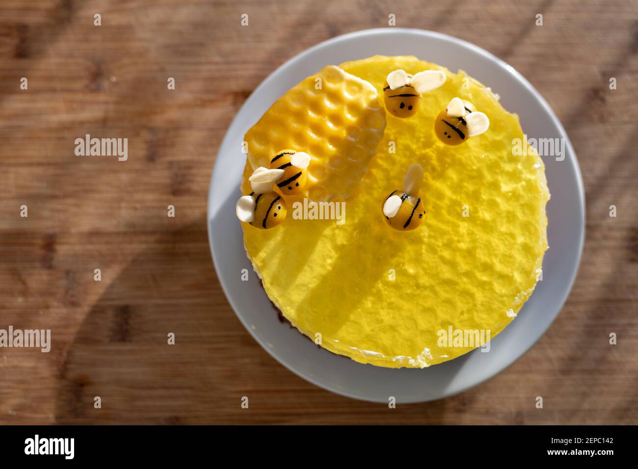 5 bees on a cake with yellow gelatine. Honeycomb structure Stock Photo ...