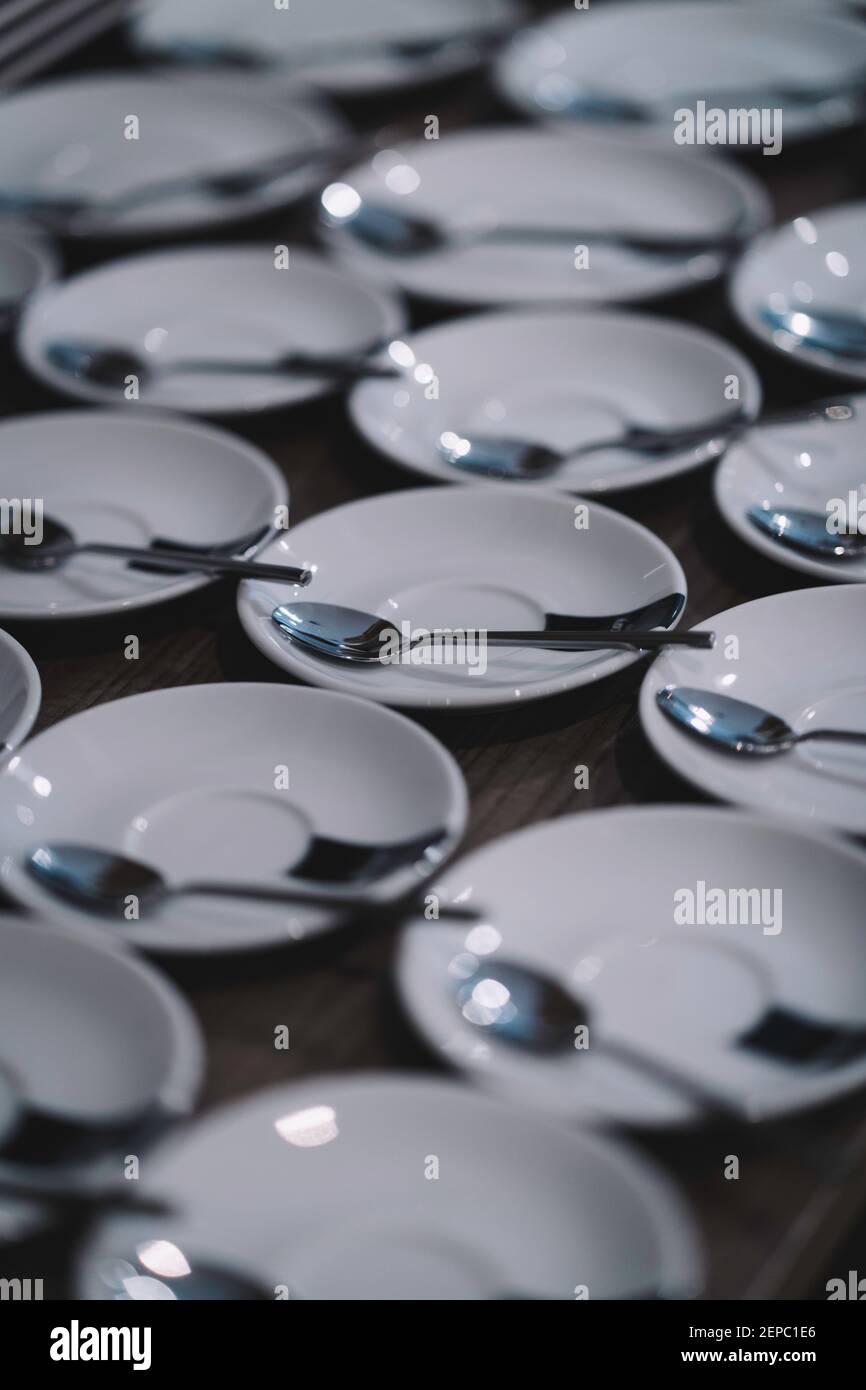 coffee plates with spoons ready to serve coffee in restaurant Stock ...