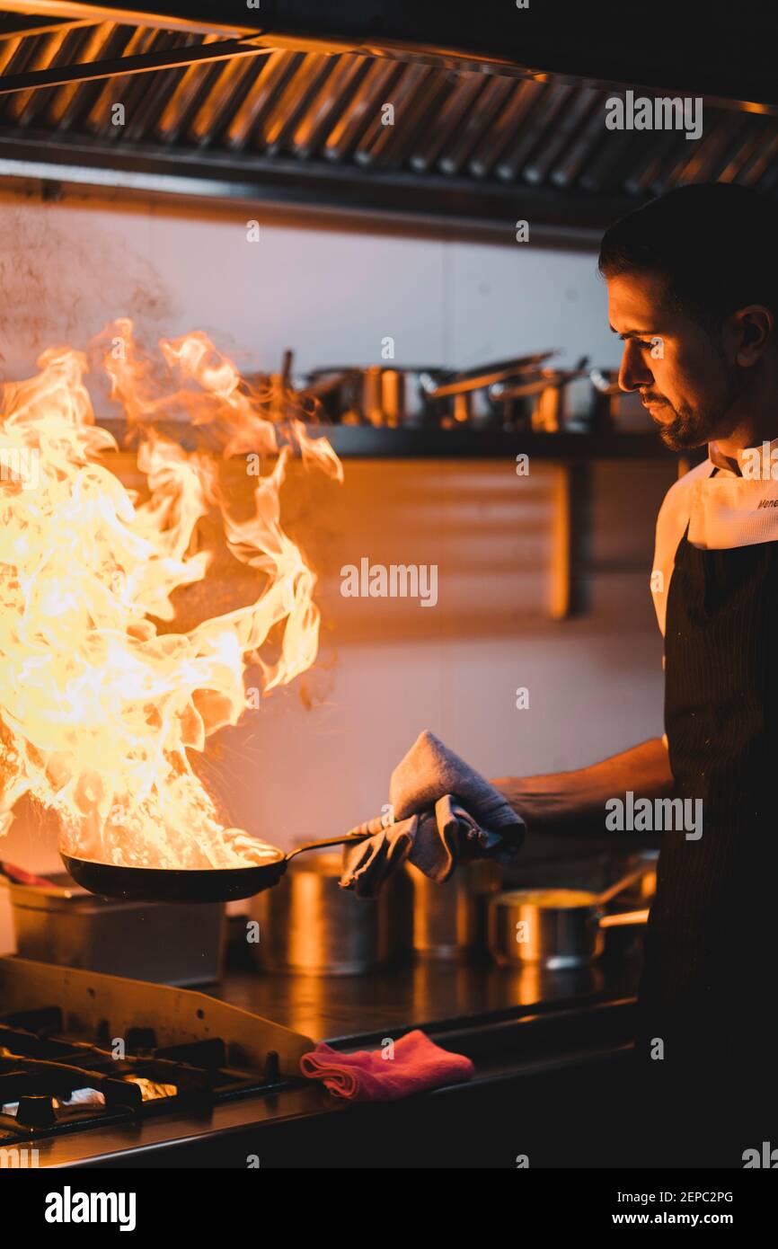 Chef sauteing in a traditional kitchen hi-res stock photography and ...