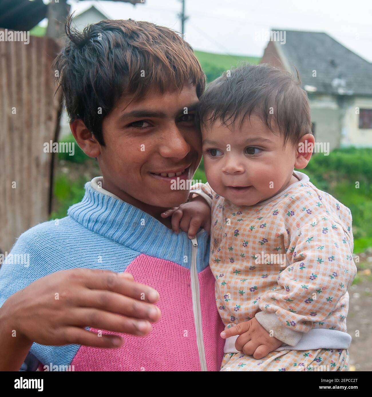 Lomnicka, Slovakia. 05-16-2018. Roma or Gypsy male adolescent holding ...