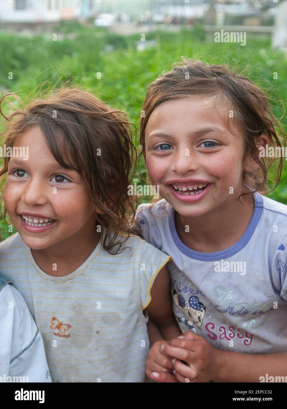 Lomnicka, Slovakia. 05-16-2018. Roma or Gypsy smiling girls in a ...