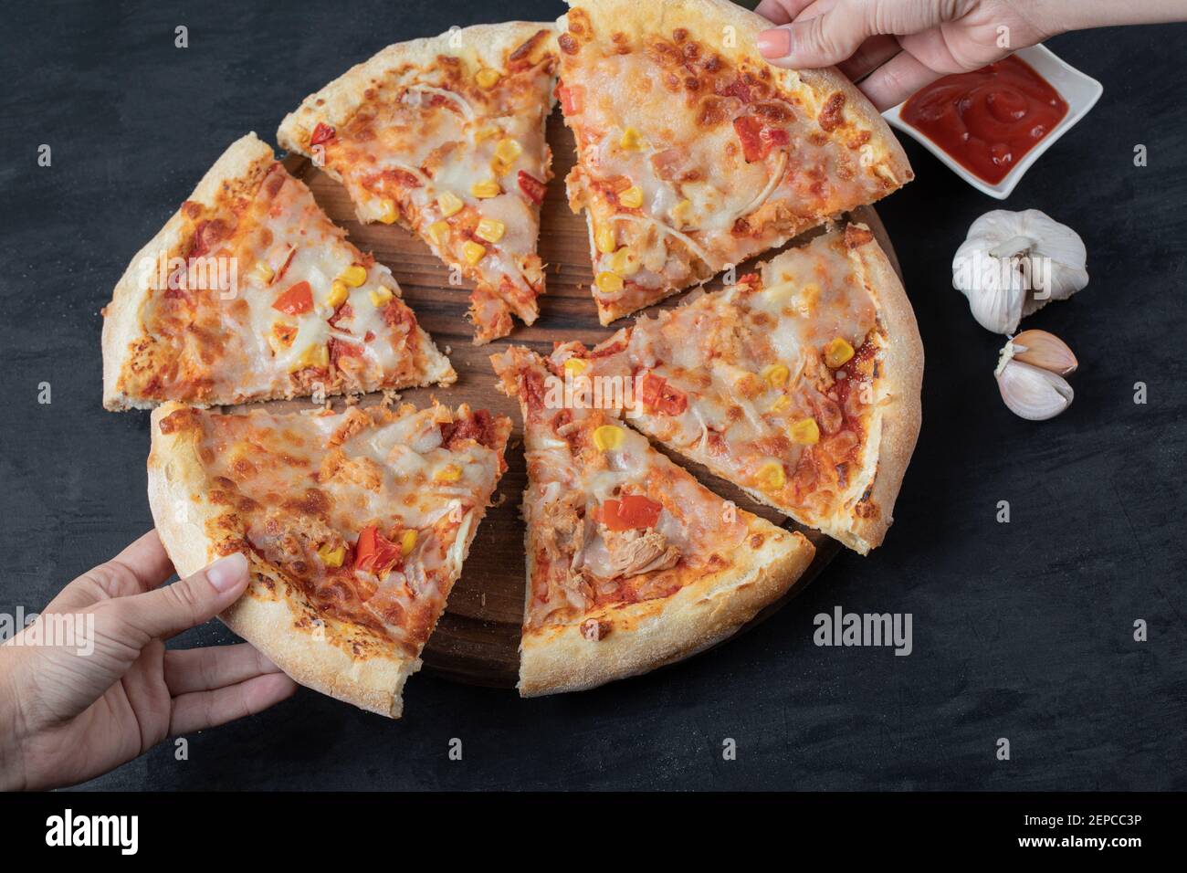 Hand taking pizza slice hi-res stock photography and images - Alamy