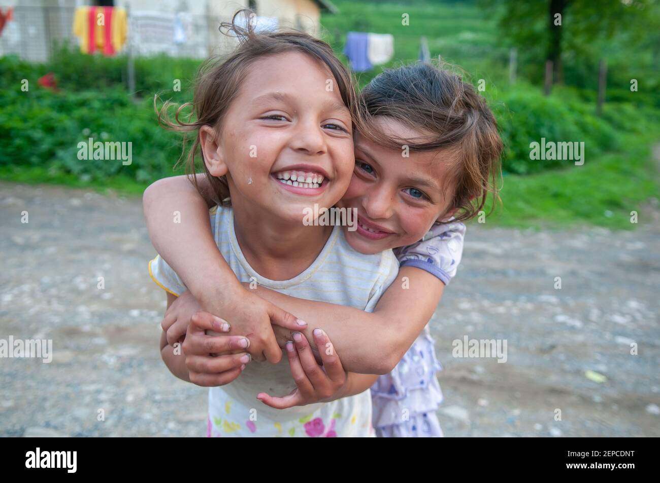 Lomnicka, Slovakia. 05-16-2018. Gypsy smiling girls living in misery ...