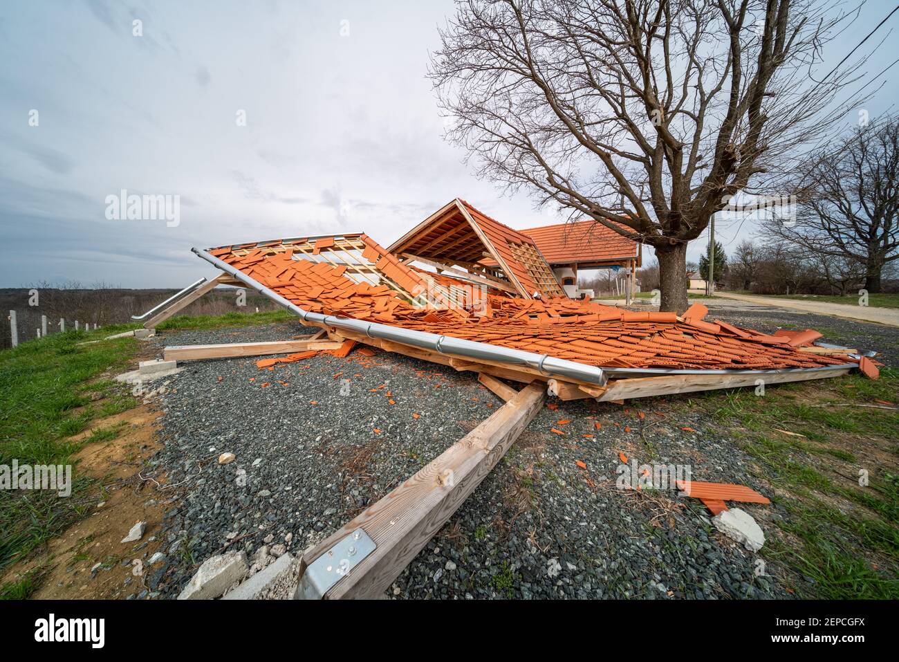 Broken roof after a storm Stock Photo - Alamy