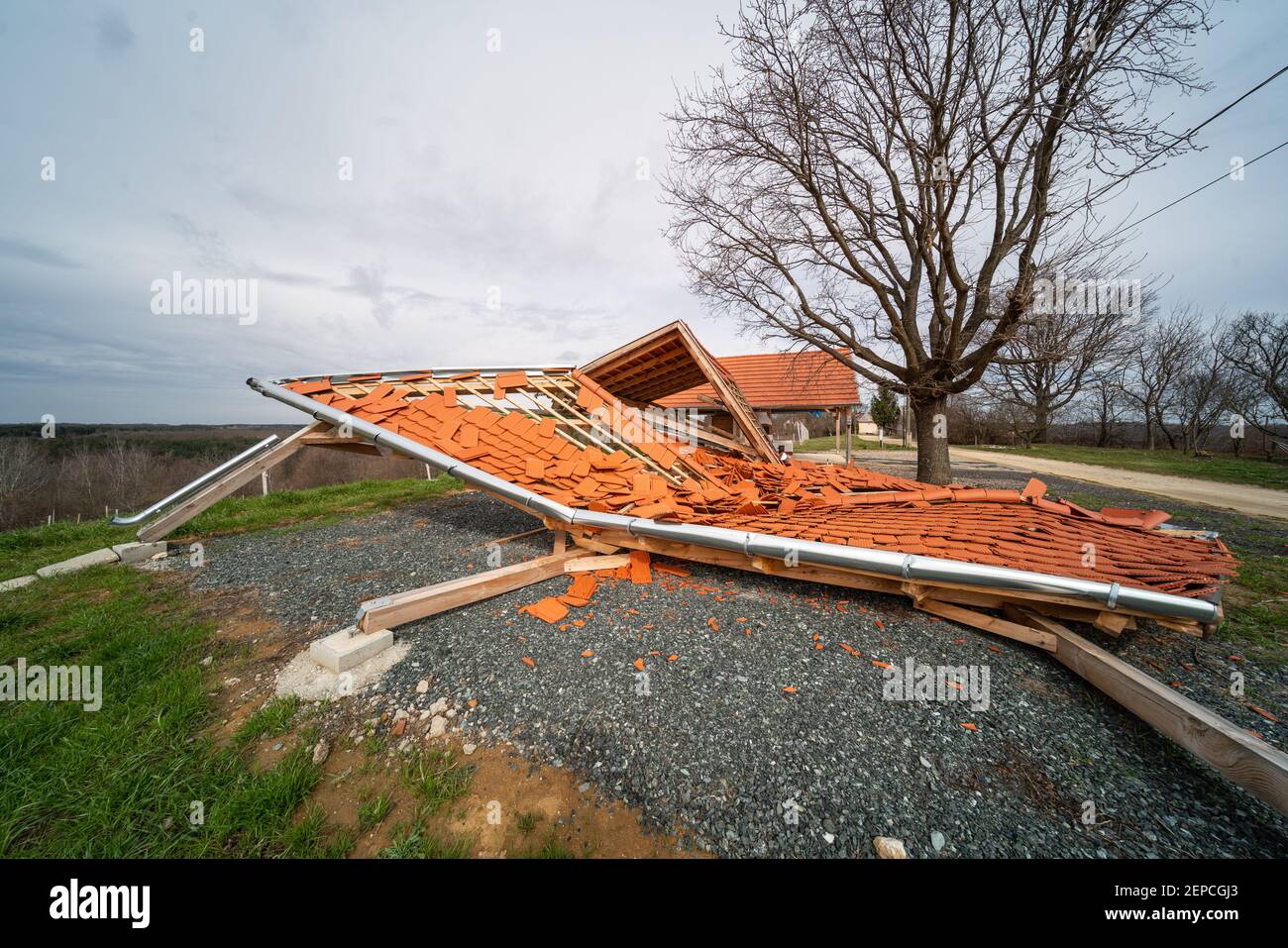 Broken roof after a storm Stock Photo - Alamy