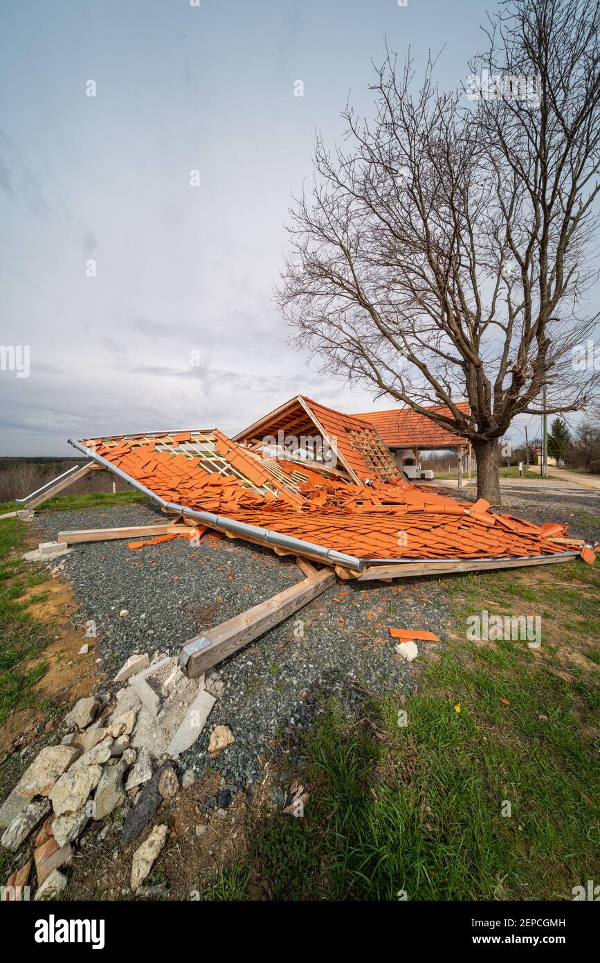 Broken roof after a storm Stock Photo - Alamy