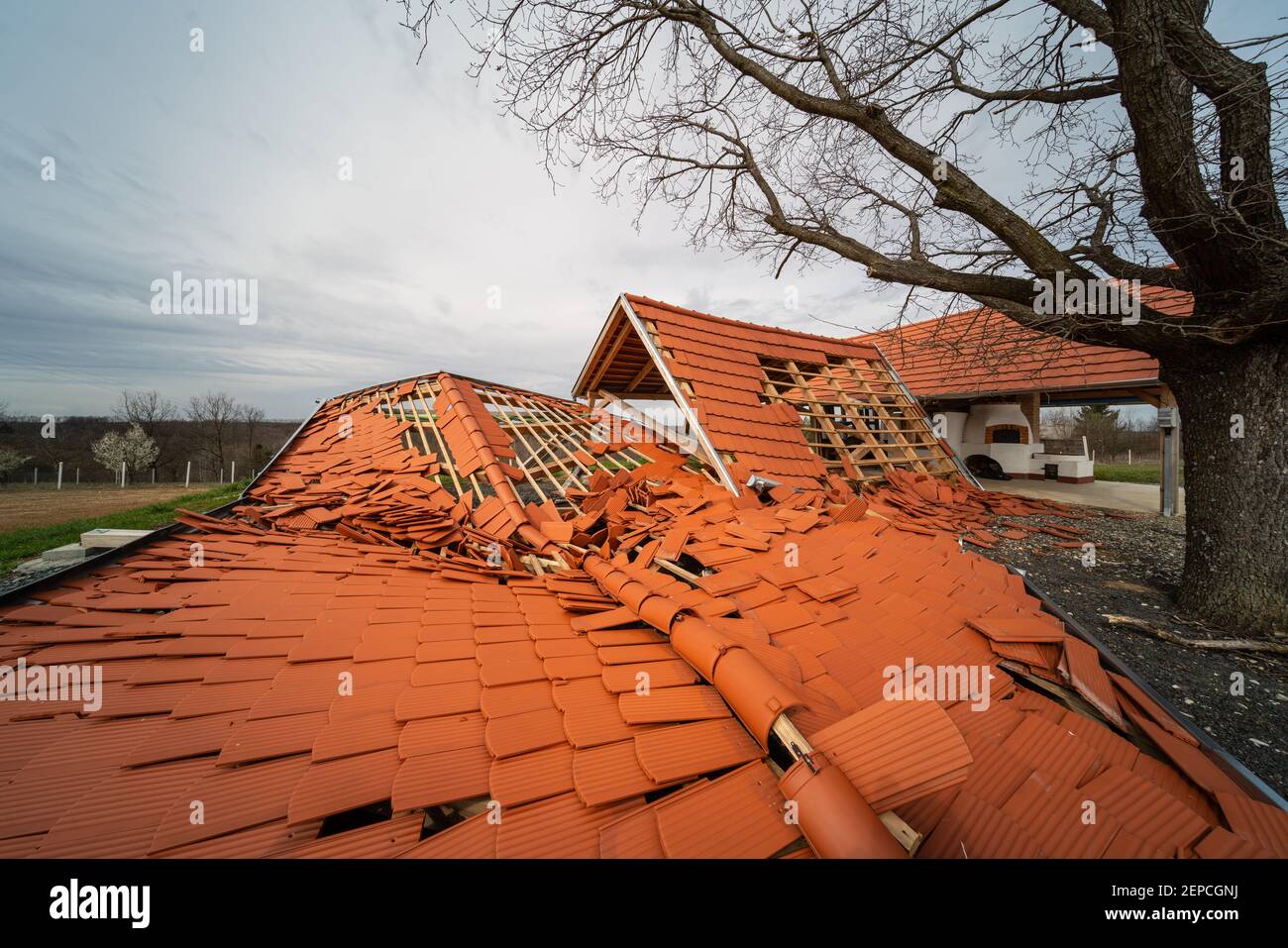 Broken roof after a storm Stock Photo - Alamy