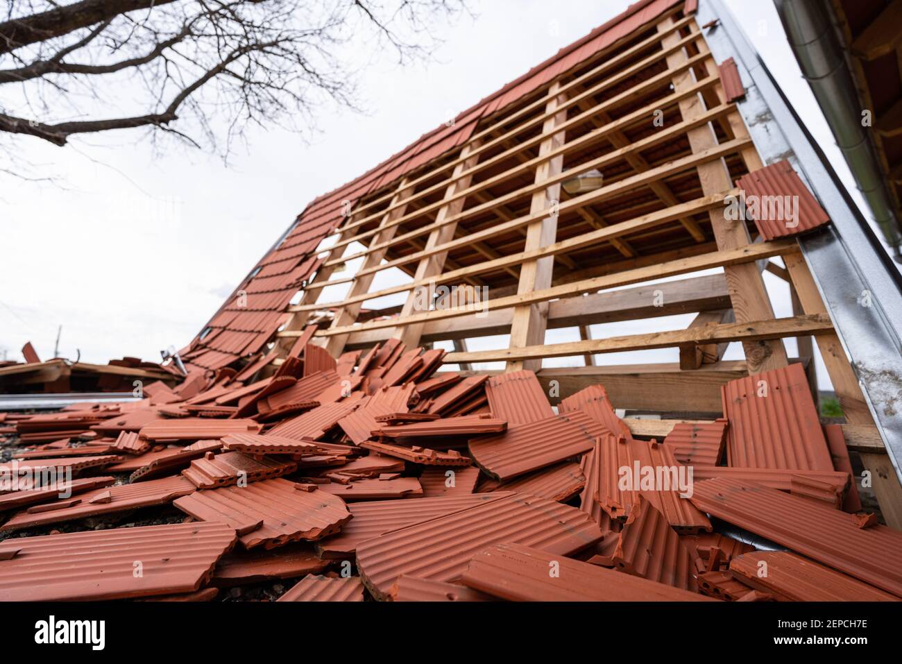 Broken roof after a storm Stock Photo - Alamy