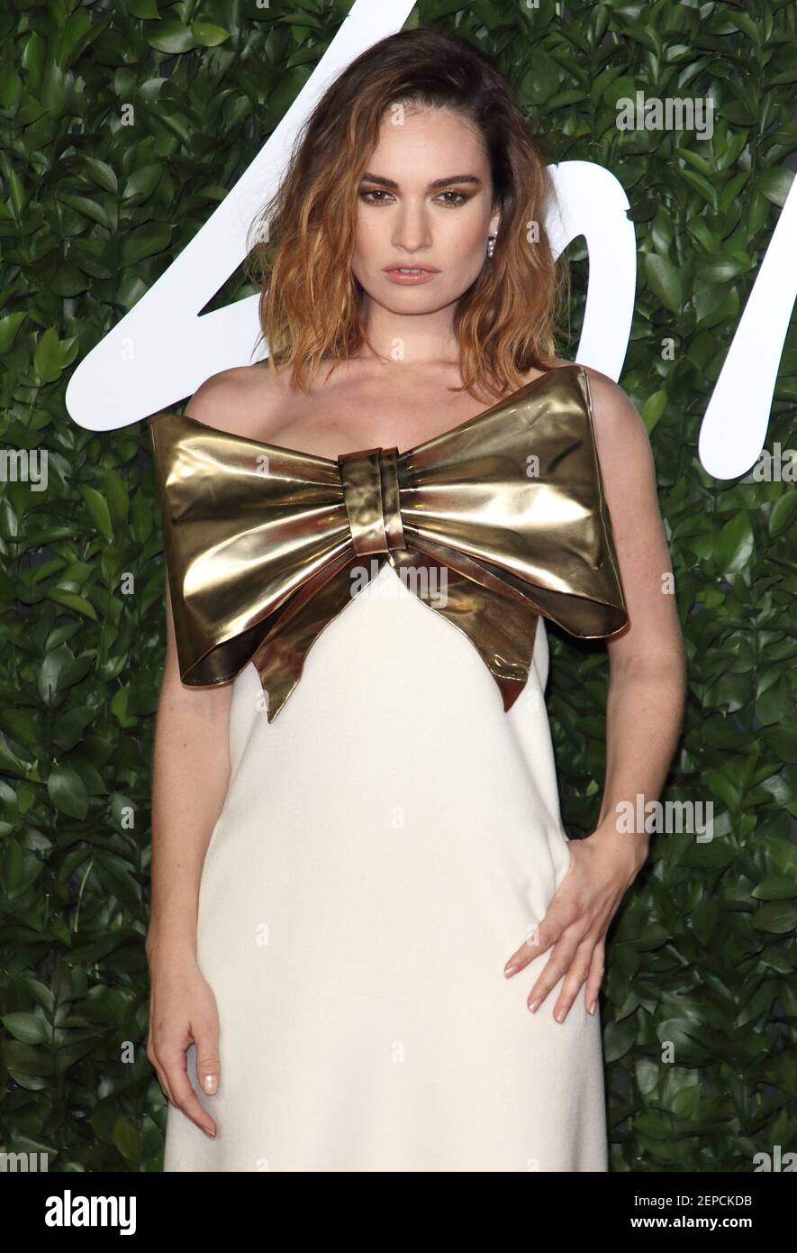 Lily James on the red carpet during The Fashion Awards at Royal Albert ...