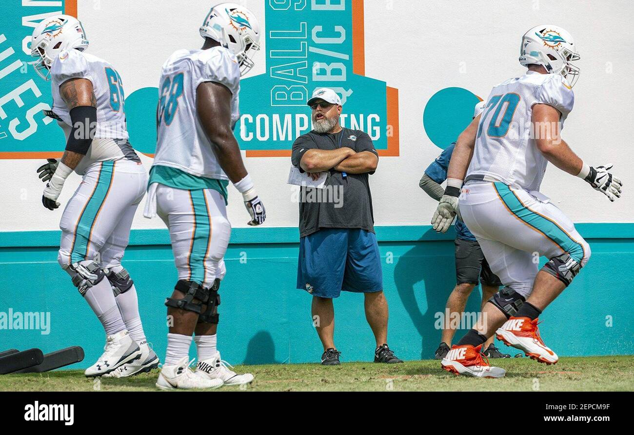 Miami Dolphins offensive line coach Dave DeGuglielmo oversees his ...