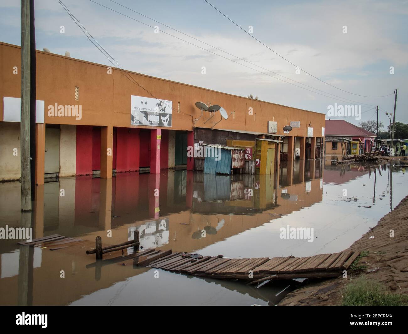 Buildings flooded. Businesses and homes damaged by flooding in Elegu ...