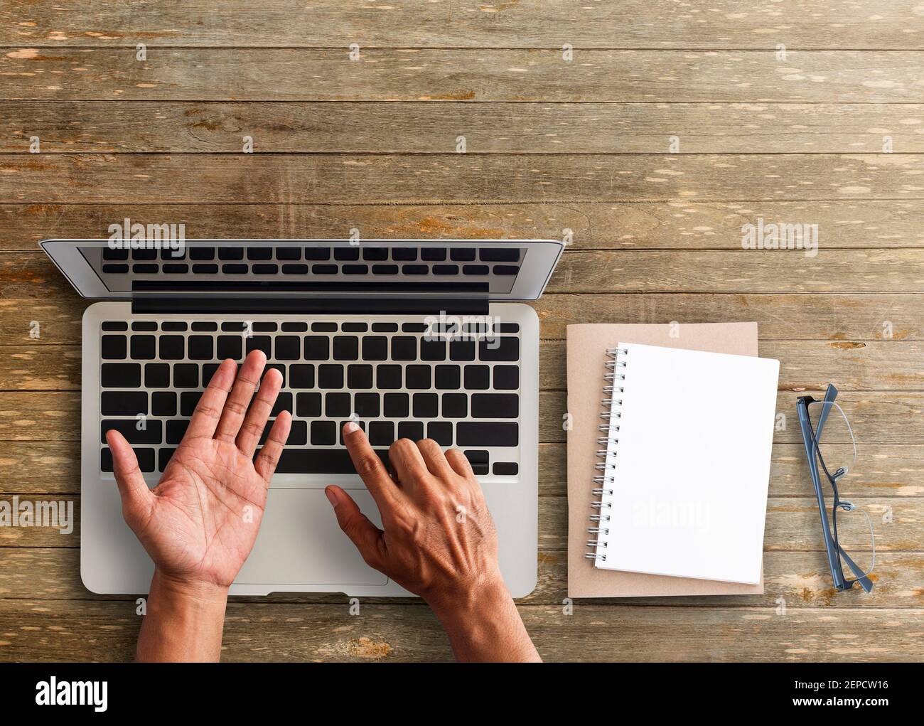 Hand, laptop, note pad hi-res stock photography and images - Alamy