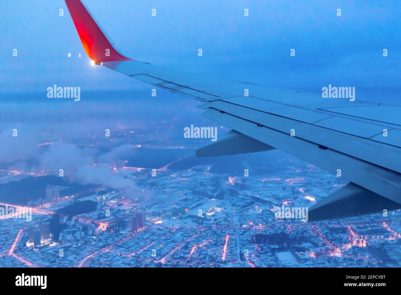 top view from a height of flight on the night city from the window of ...