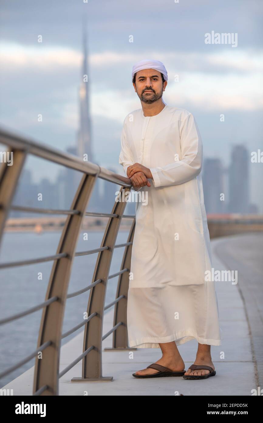 emirati Man at Al Jaddaf waterfront in Dubai with Burj Khalifa at the ...