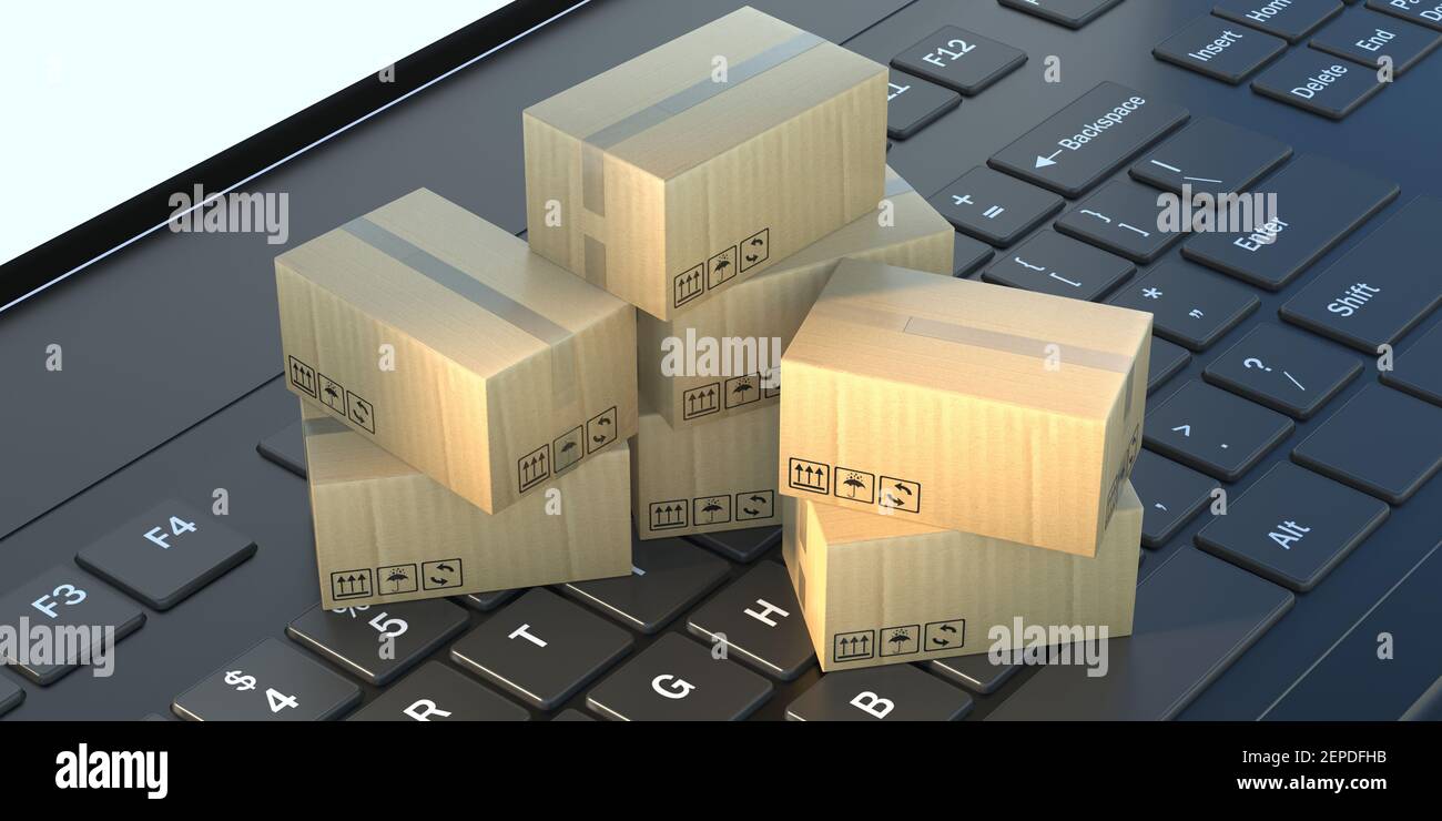 Cardboard box packages on computer laptop keyboard background. Online ...