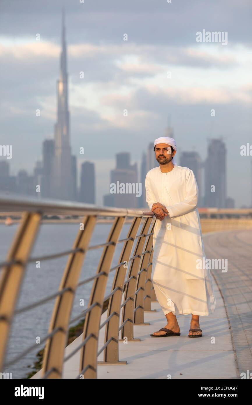 emirati Man at Al Jaddaf waterfront in Dubai with Burj Khalifa at the ...