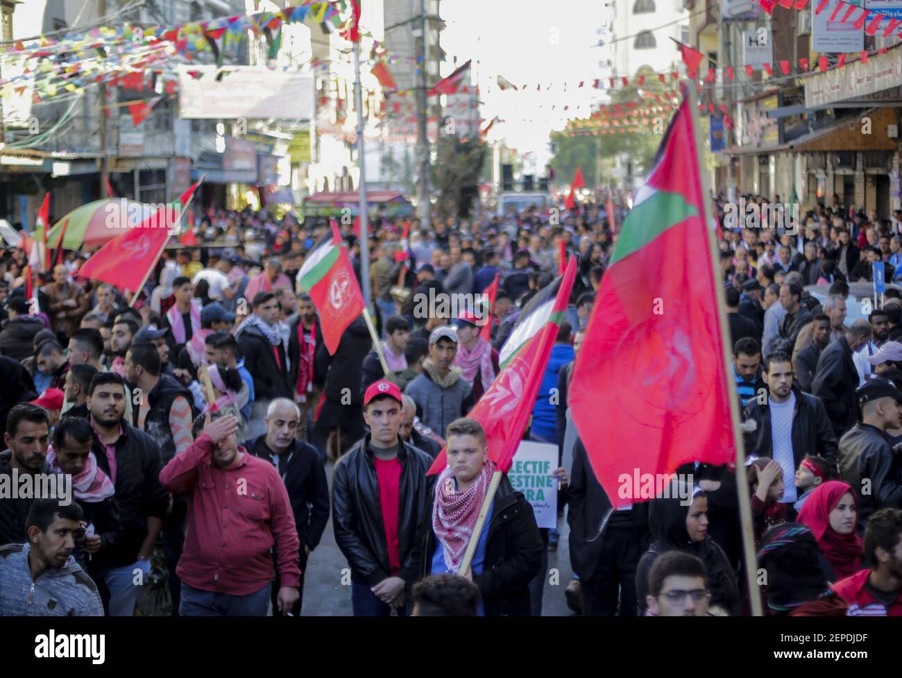 Crowd of Palestinians with flags during the rally. The Popular Front ...