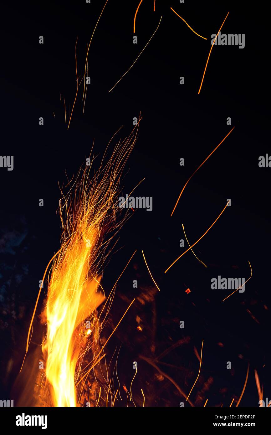 Night bonfire with sparks. Fire bright vertical background Stock Photo ...
