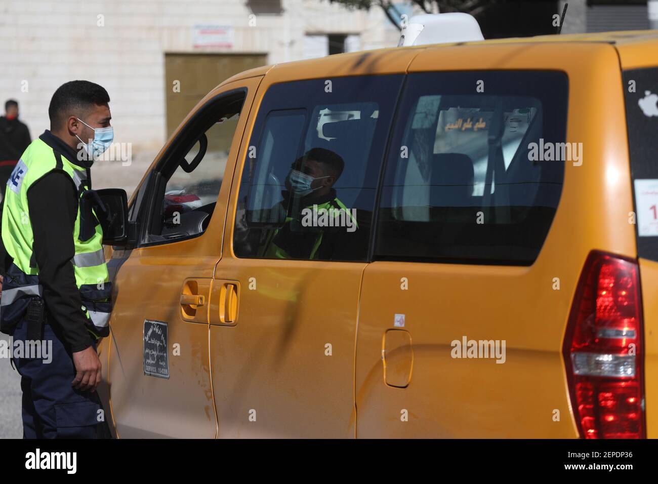 Hebron. 27th Feb, 2021. A police officer works at a checkpoint in the ...