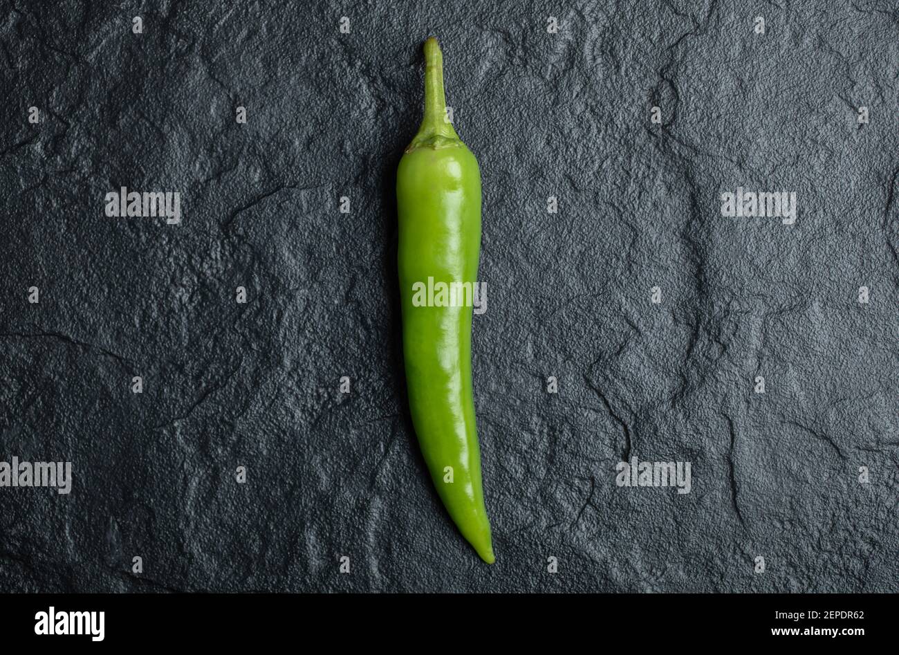 Top view of fresh green pepper n black background Stock Photo - Alamy