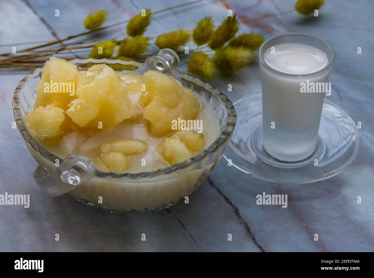 Cassava in syrup usually served with coconut milk on marble table ...