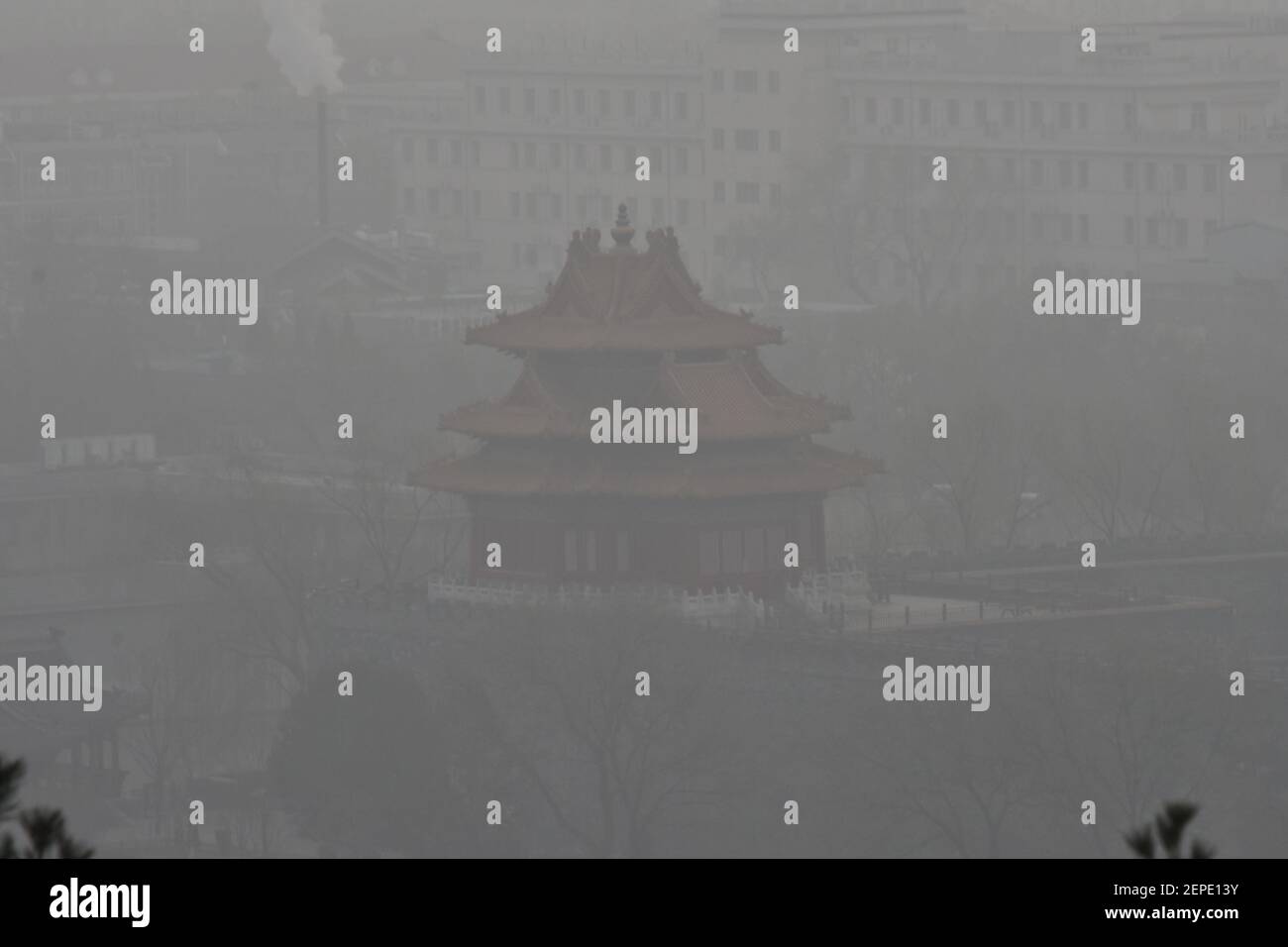 An aerial view of local landmarks seen faintly in the haze in Beijing ...