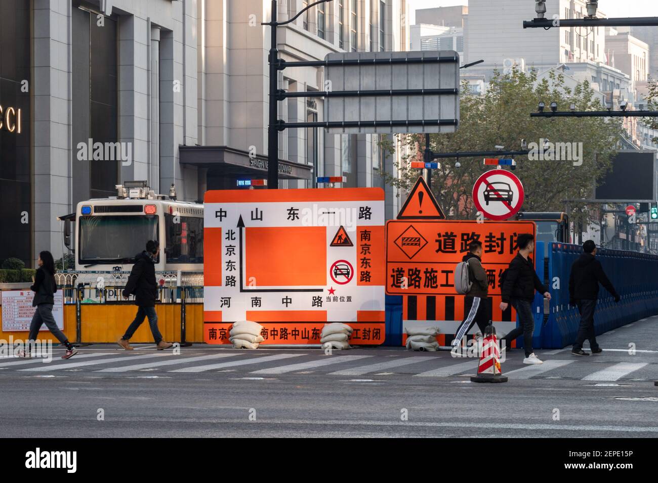 Signs and roadblocks are deployed to stop traffic near Nanjing Road as ...