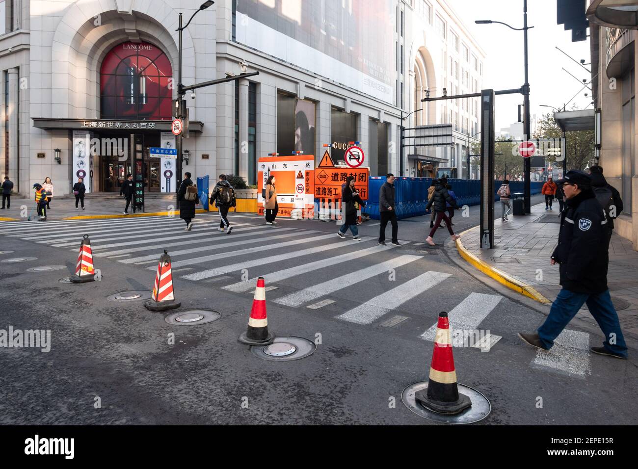 Signs and roadblocks are deployed to stop traffic near Nanjing Road as ...