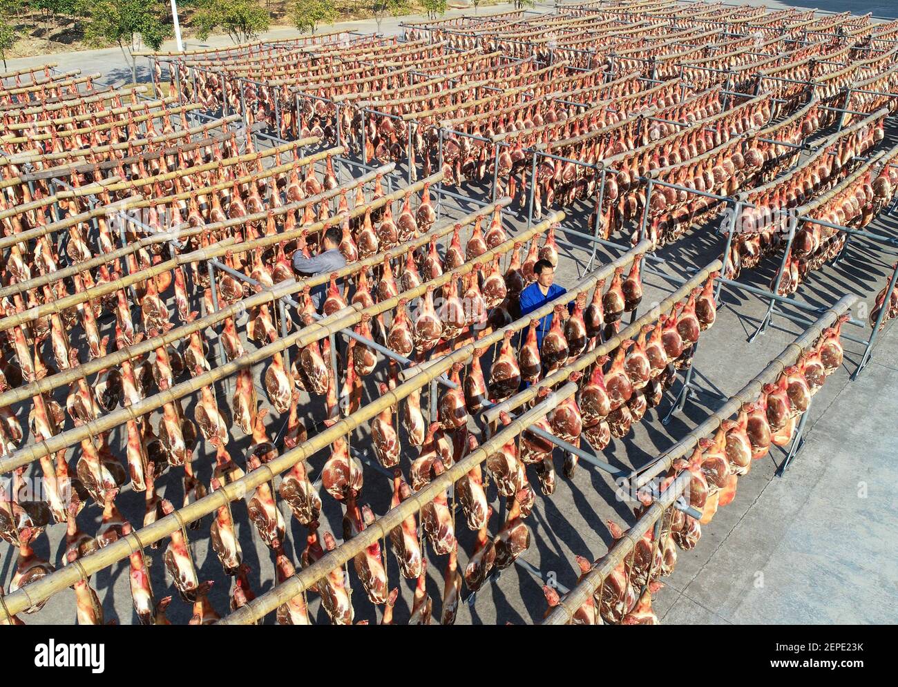 Lines of Jinhua hams, a type of dry-cured ham named after the city, are ...