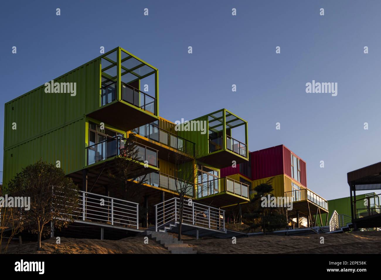 A colorful container hotel, a hotel composed of various container and ...