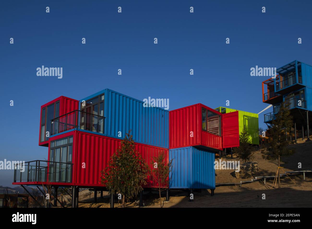 A colorful container hotel, a hotel composed of various container and ...