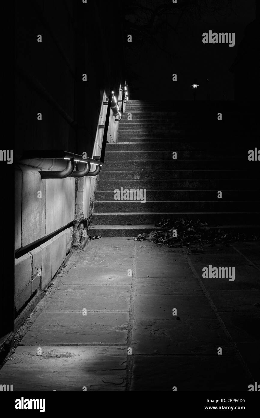 Black and white monochrome image of shadowed view of steps at night ...