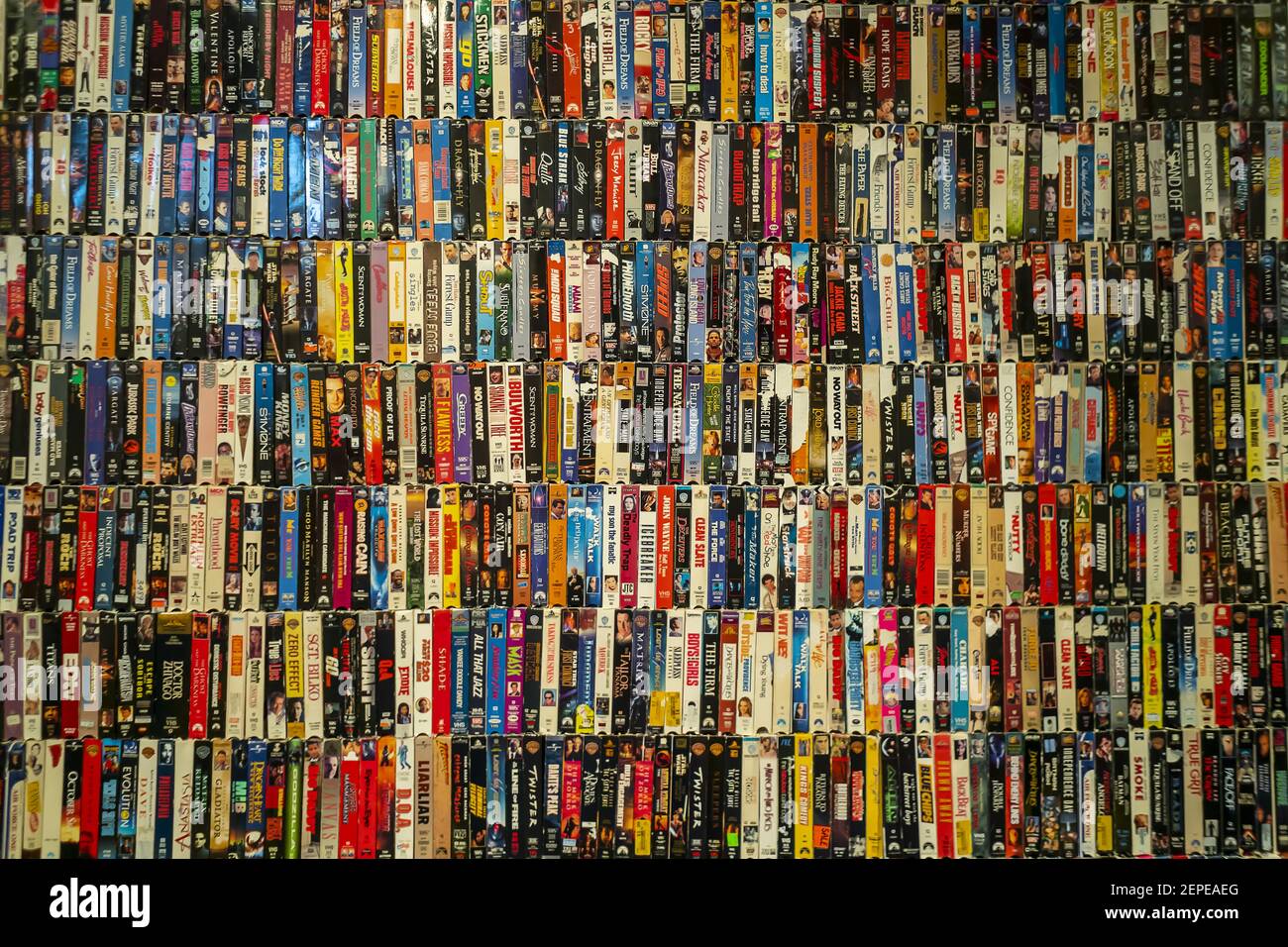 Display of VHS tapes in a pop-up featuring merchandise with the logos ...