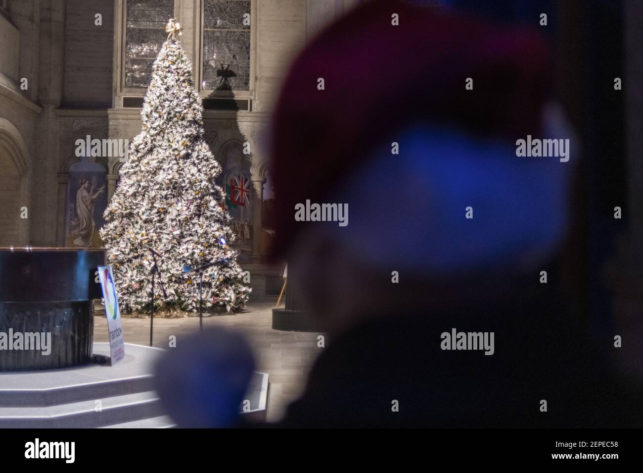 A participant of the origami Christmas tree lighting ceremony admires ...