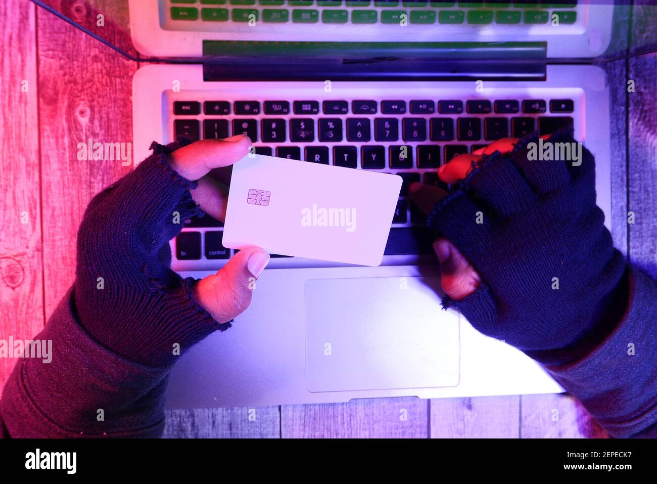 hacker hand stealing data from credit card Stock Photo - Alamy