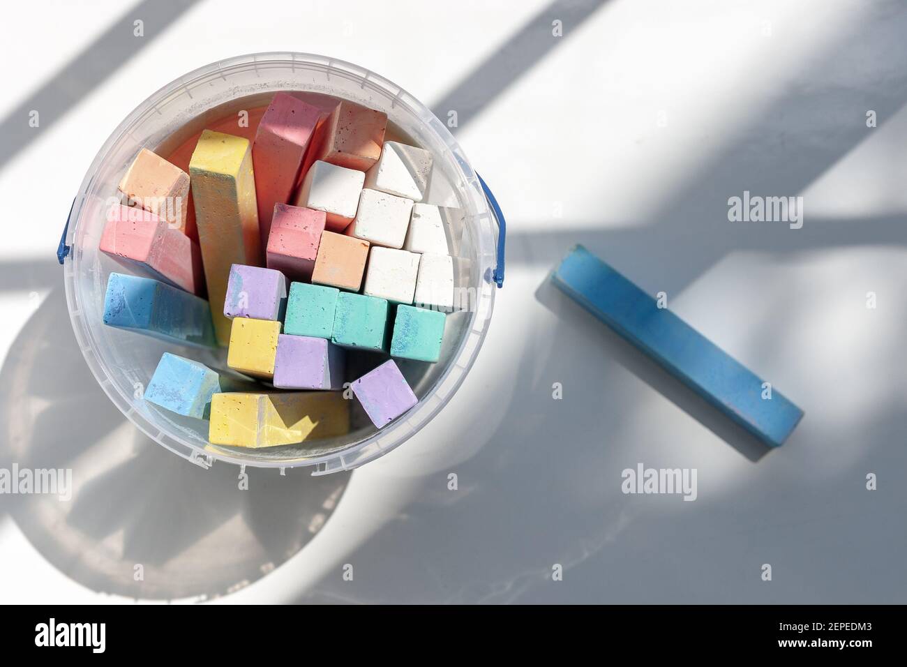 color chalk at plastic container on the light background. back to ...