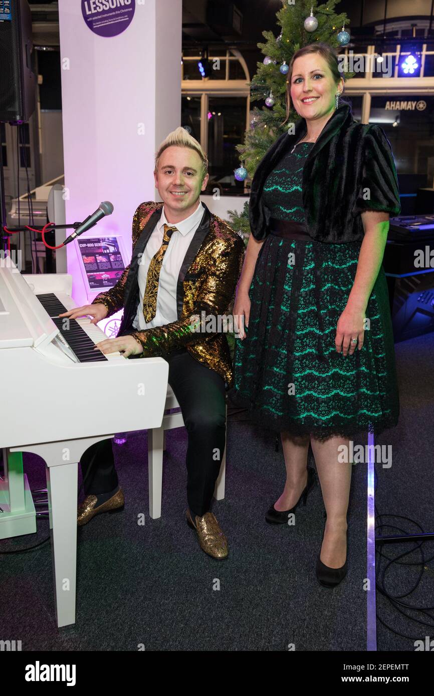 John Galea and Hannah Long perform festive songs at the Yamaha Store in ...