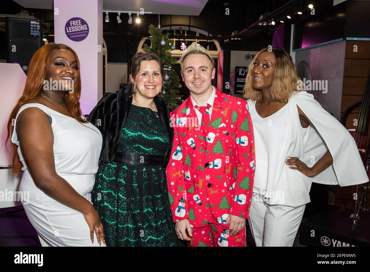 John Galea and guests pose for a photo during his music event at the ...