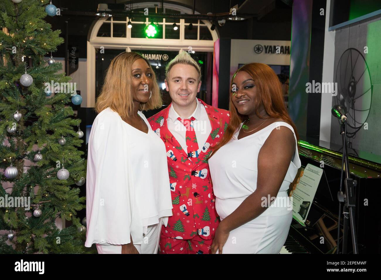 John Galea and guests pose for a photo during his music event at the ...