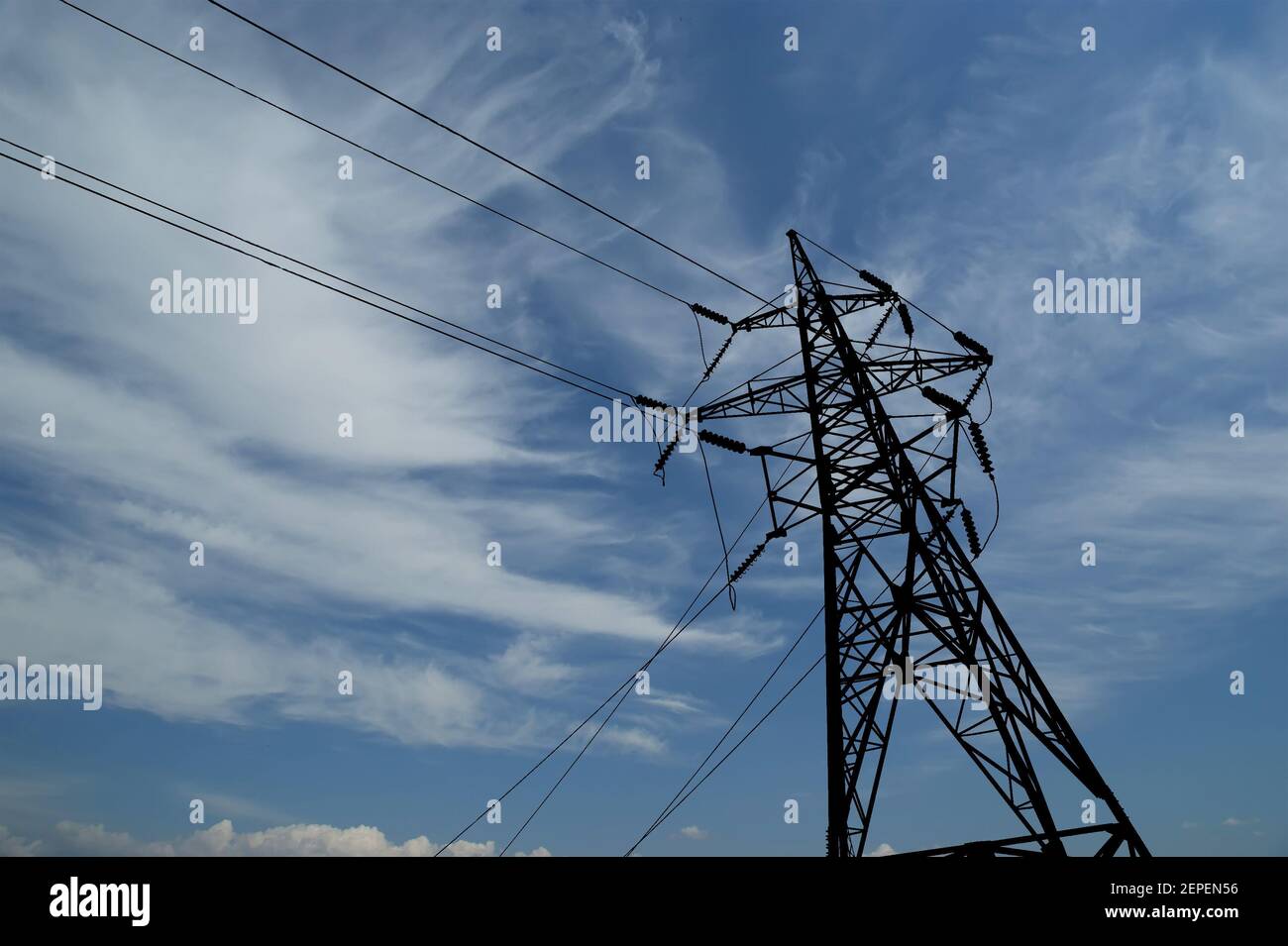 Electricity pylons and line against the blue sky and clouds Stock Photo ...