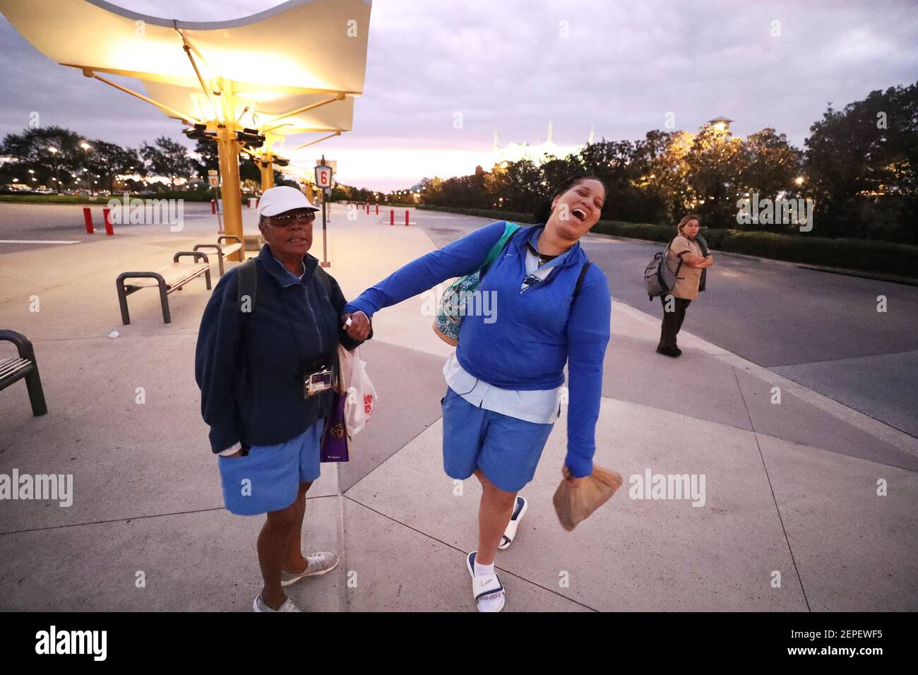 Nicky Wilkins, 36, left, shares a laugh with her friend and Disney ...