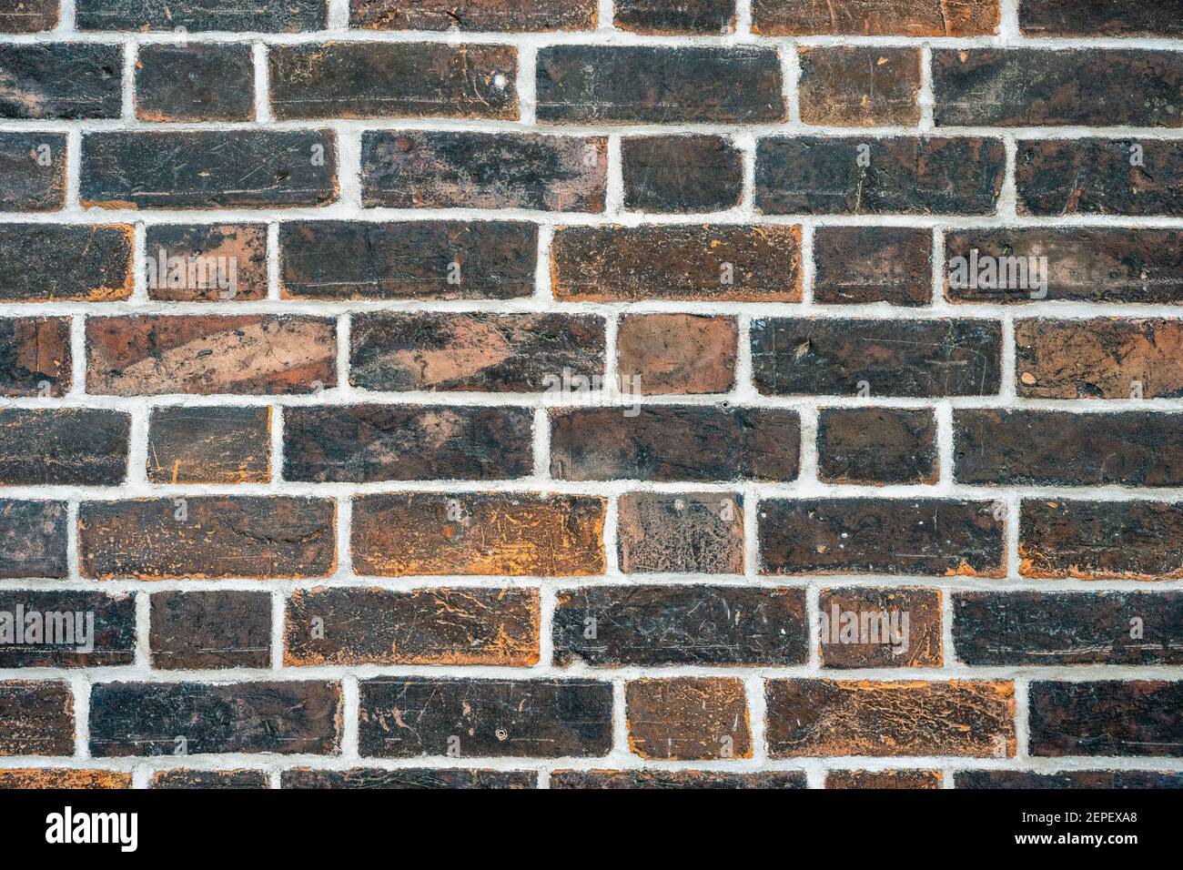 Dark red brick wall hi-res stock photography and images - Alamy