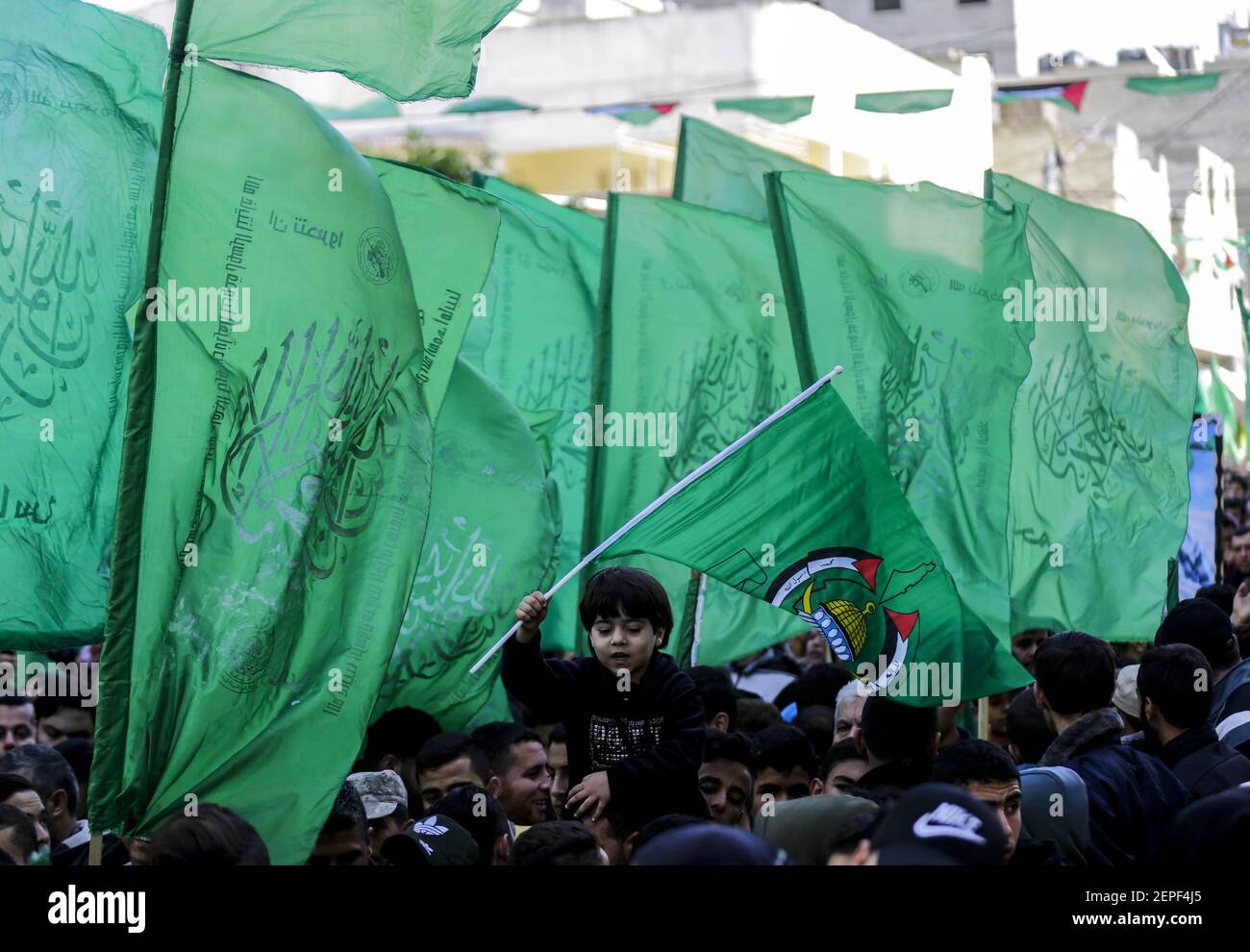 Palestinian Hamas kid supporter waving a flag during a rally marking ...
