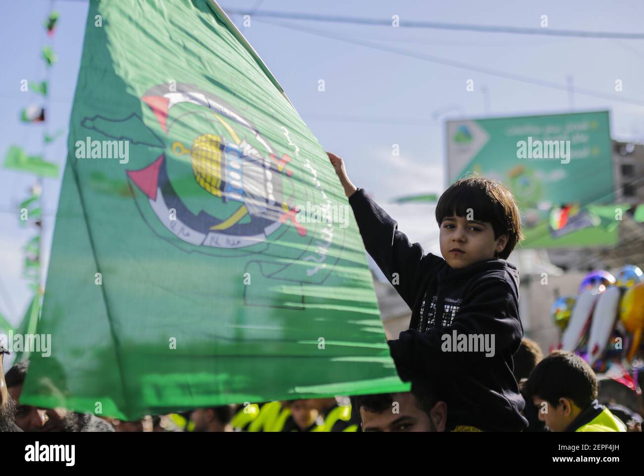 Palestinian Hamas kid supporter waving a flag during a rally marking ...