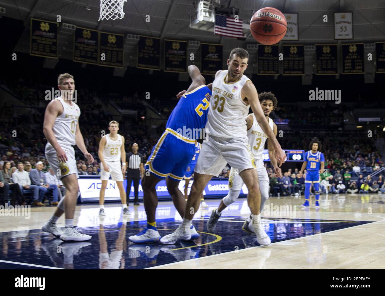 December 14, 2019: Notre Dame forward John Mooney (33) and UCLA forward ...