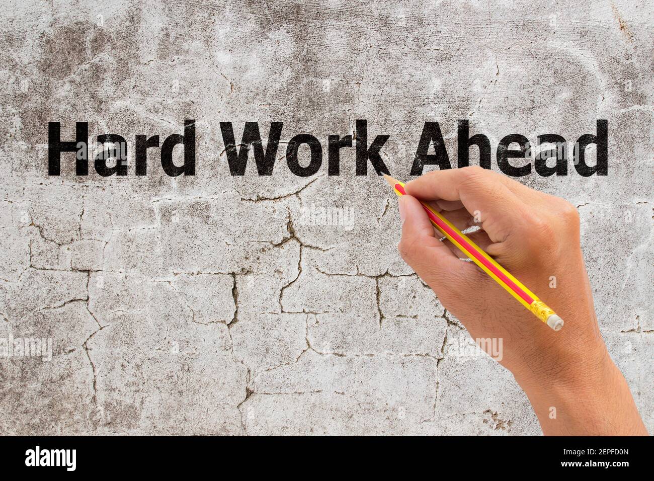 Hand with marker writing the text - Hard Work Ahead on grunge ...